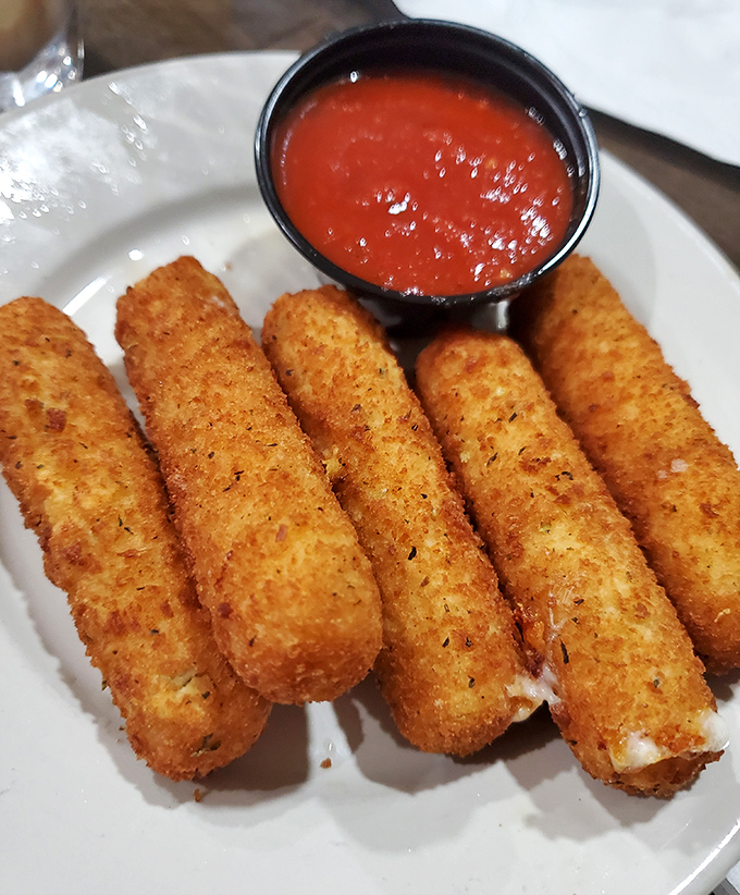 7. mozzarella sticks
Mozzarella sticks: the adult version of string cheese that got all dressed up for a night out. Crispy, golden, and ready for their marinara bath.