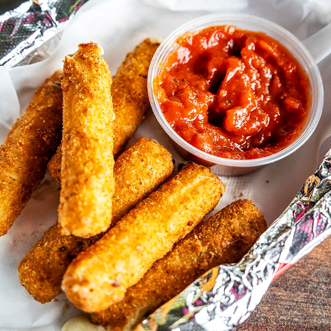 Mozzarella sticks: where stretchy cheese meets crispy coating in perfect harmony. The ultimate comfort food that never goes out of style.