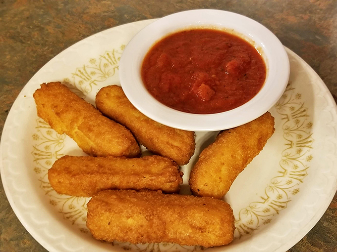 Golden-brown mozzarella sticks with marinara—the universal language of "Yes, you deserve this." Crispy outside, molten inside, completely irresistible.