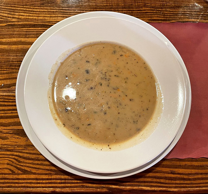This mushroom soup looks like it contains the distilled essence of an entire forest floor. Earthy, creamy, and soul-warming in a single spoonful.