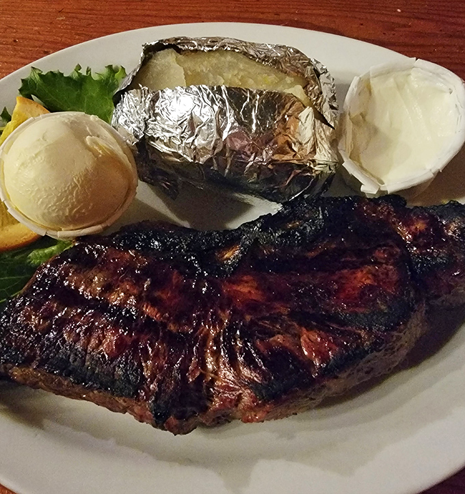 This New York steak with its picture-perfect sear could make a vegetarian question their life choices. The baked potato stands by loyally.