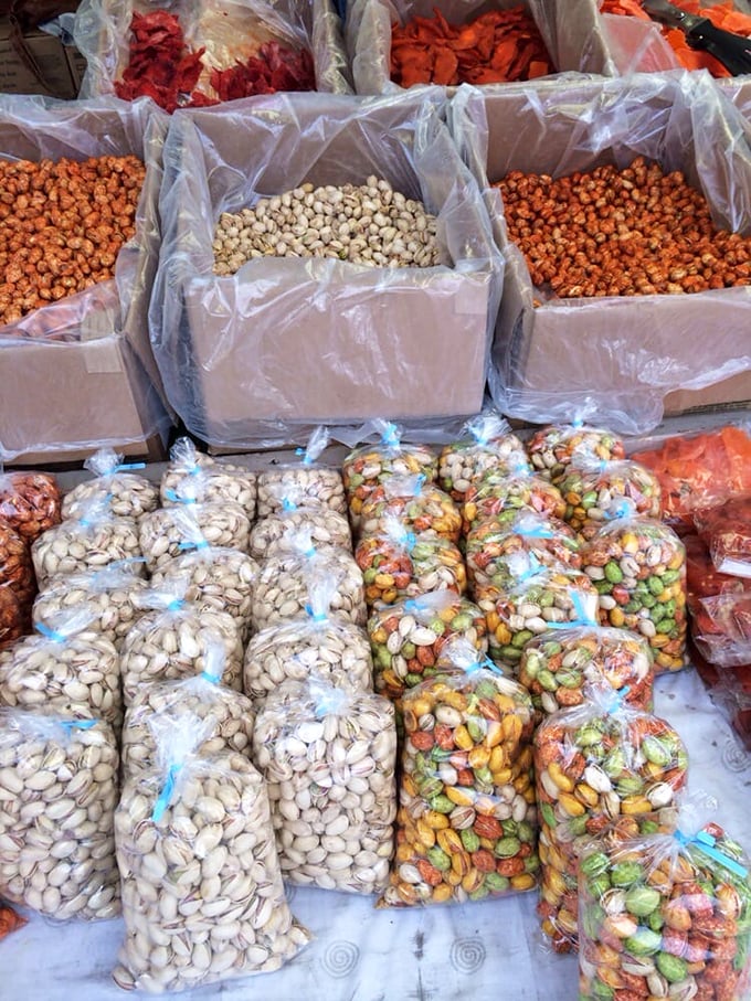 Nutty paradise where pistachios, almonds, and their crunchy cousins wait patiently in their plastic homes for snack-loving new owners. 