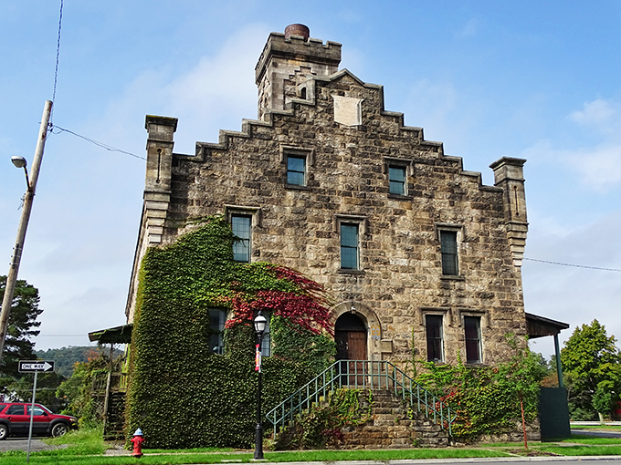 The Old Clearfield County Jail's imposing stone façade tells tales of frontier justice. Now ivy-covered, it's transformed from a place of confinement to an architectural conversation piece.