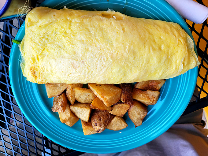 An omelet so perfectly executed it deserves its own cooking show, with home fries that could convert a hash brown loyalist.