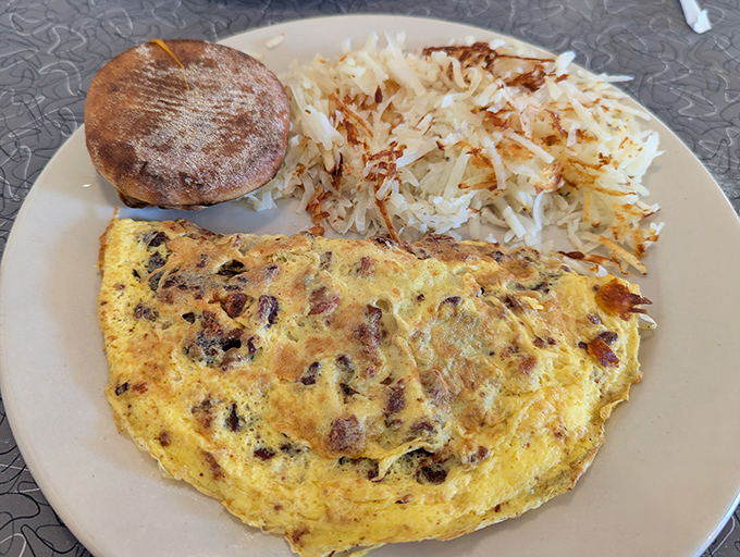 This omelet showcases the kind of fluffy perfection that transforms simple eggs into pure breakfast poetry and satisfaction.