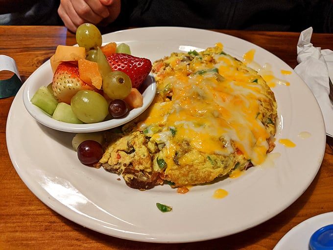 An omelet that doesn't just whisper "good morning" &ndash; it belts out "HELLO SUNSHINE!" with cheese, veggies, and a side of fresh fruit.