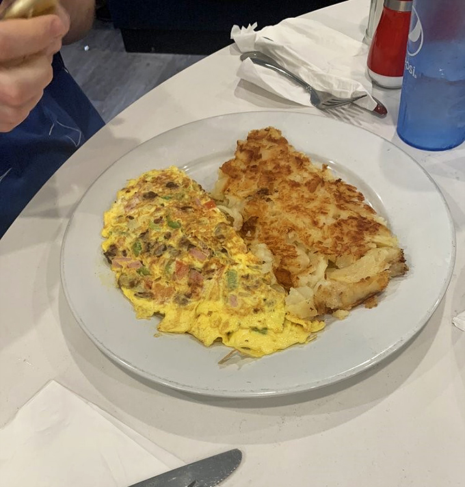 An omelet that's seen the inside of a skilled hand &ndash; paired with hash browns so crispy they practically snap, crackle, and pop.