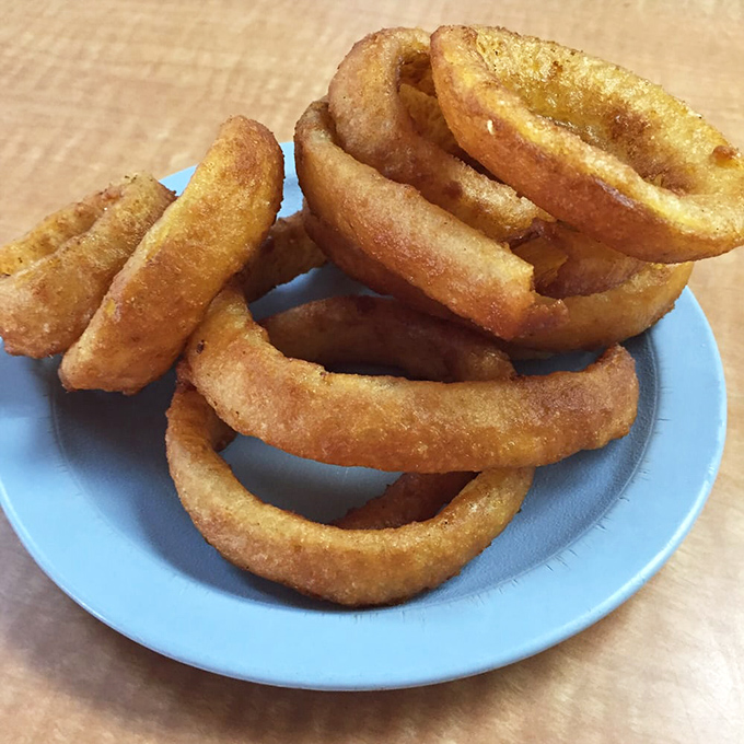Golden halos of crispy perfection. These onion rings aren't just a side dish&mdash;they're the supporting actors that steal the show.
