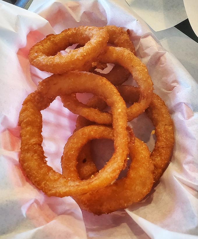 Onion rings that shatter with satisfying crispness. These golden halos aren't just sides&mdash;they're the supporting actors that deserve their own Oscar.