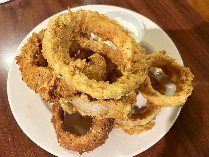 These aren't just onion rings&mdash;they're golden halos of happiness, crispy enough to make you forget your table manners.