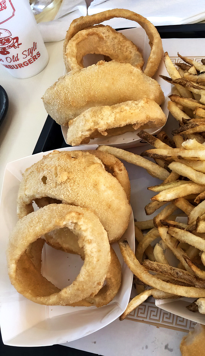 Onion rings with the architectural integrity of Olympic medals. That golden-brown color is what dreams are made of.