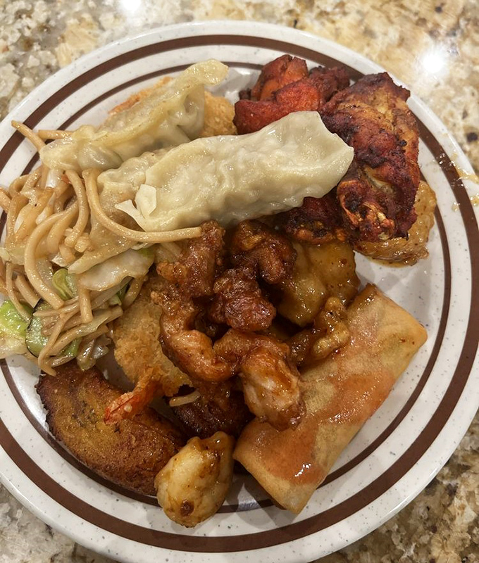 The ultimate buffet test plate: a little bit of everything. That orange chicken is calling your name louder than your high school reunion.