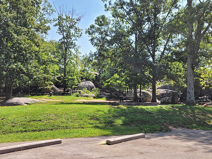 The well-maintained picnic area provides a perfect resting spot after boulder-hopping, proving even prehistoric landscapes can accommodate modern comfort.