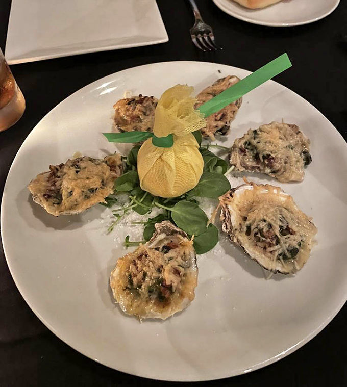 Oysters arranged like a delicious clock face, each one a briny little treasure chest. That lemon sachet in the center is the kind of detail that separates good from great.