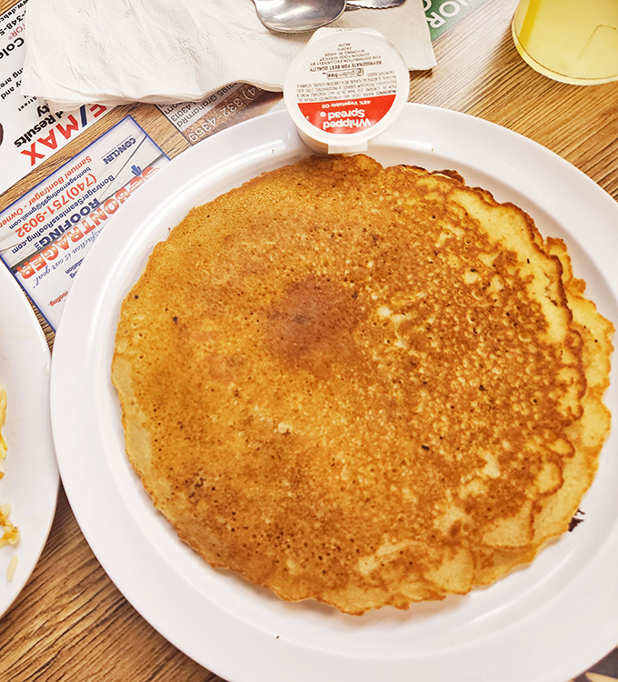 The perfect pancake isn't about being photogenic—it's about that golden-brown exterior giving way to a fluffy interior that soaks up syrup like it was designed by maple scientists.