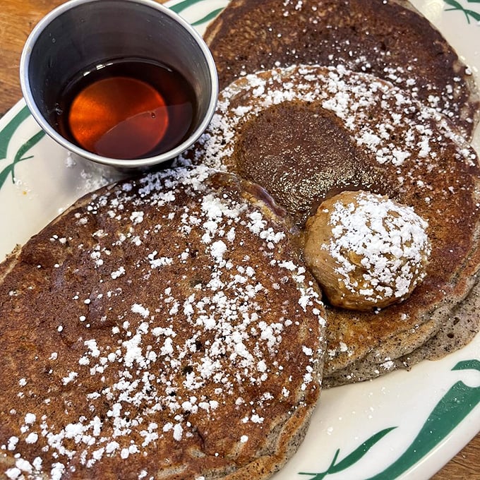 Buckwheat pancakes dusted with powdered sugar snow, waiting for that maple syrup waterfall. Breakfast or dessert? Yes, please.
