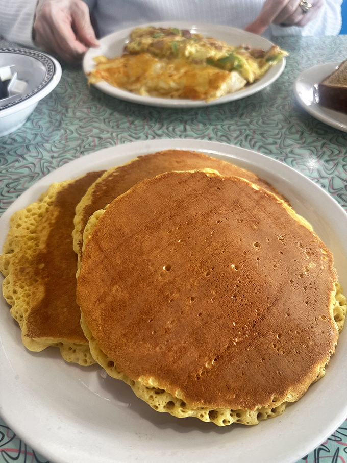 Pancakes so perfectly golden they belong in a museum, though they're better destined for a generous maple syrup baptism.