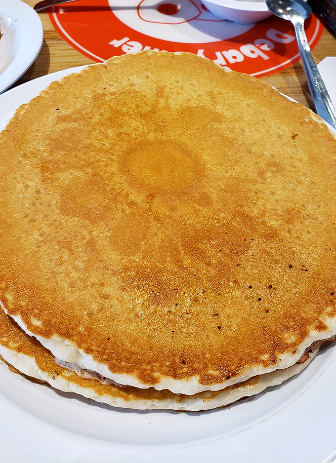 Pancakes the size of hubcaps, golden-brown and ready for their maple syrup baptism. Breakfast or an edible frisbee? You decide.