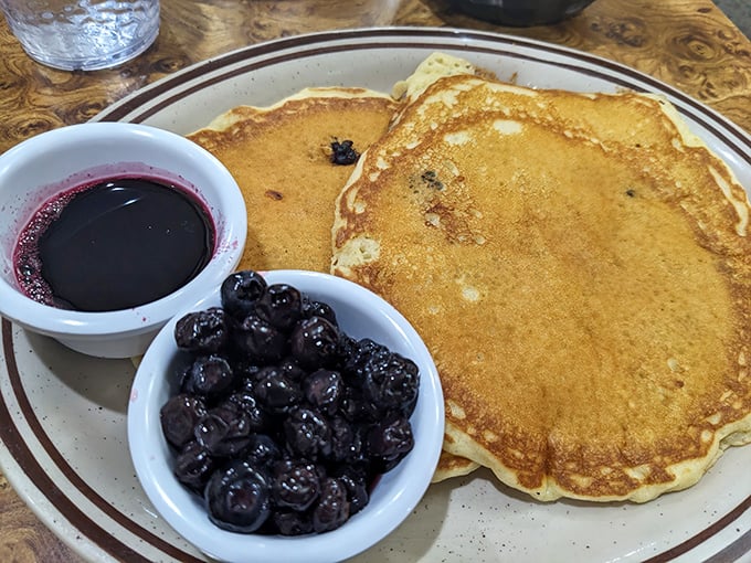 These pancakes aren't just breakfast, they're therapy &ndash; golden discs of comfort served with blueberries that pop like tiny flavor bombs.