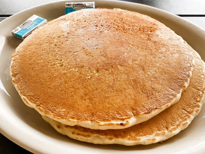 Pancakes so perfectly golden they belong in Fort Knox. These fluffy discs of joy are the breakfast equivalent of a warm hug.