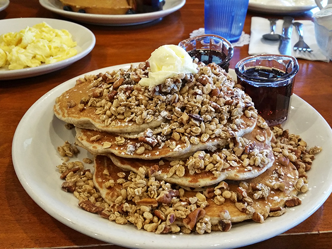 Pancakes that could make IHOP executives weep, crowned with a mountain of pecans and a snowfall of powdered sugar.