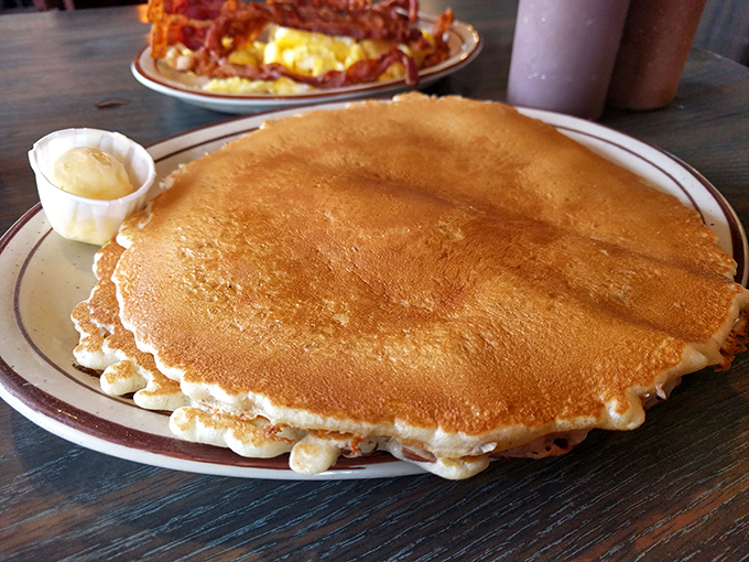 A pancake so perfectly golden it deserves its own California zip code&mdash;stretching to the plate's edge with a side of butter melting into breakfast bliss.