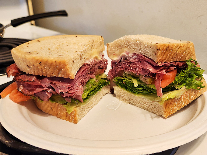 Pastrami perfection on display. The pickle isn't just a garnish—it's the exclamation point at the end of a delicious sentence..