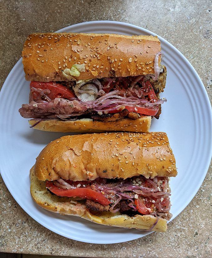 Layer upon glorious layer of Italian meats, fresh veggies, and cheese on sesame-seeded perfection. Sandwich architecture at its finest.