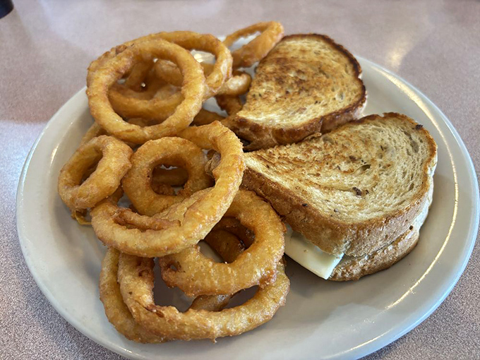 The onion rings and grilled sandwich combo&mdash;proof that lunch at Mama's is just as worthy of your elastic-waist pants as breakfast.
