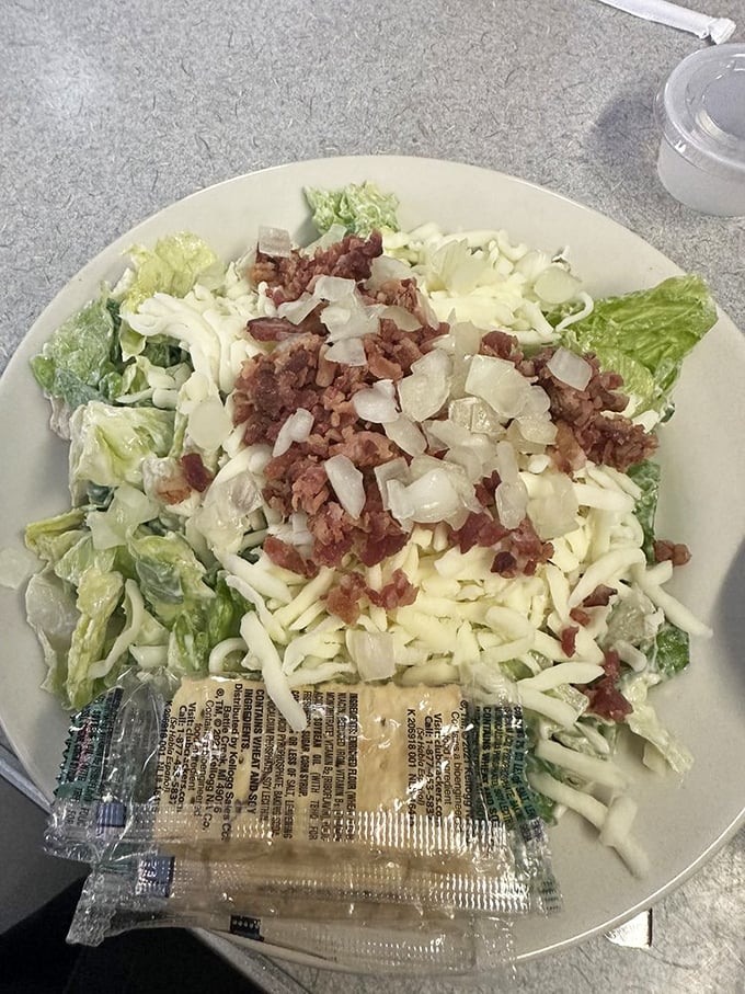 This isn't just any salad &ndash; it's Midwest ingenuity on a plate, where bacon bits and cheese transform vegetables into comfort food.