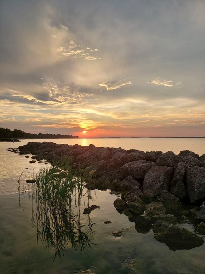 As day bids farewell, Erie Beach transforms into nature's cinema, projecting a sunset spectacular that outshines anything Hollywood could dream up.