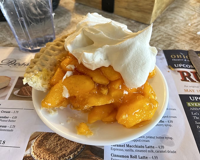 Summer captured in a pie shell&mdash;this peach masterpiece topped with whipped cream is what fruit dreams about becoming when it grows up.