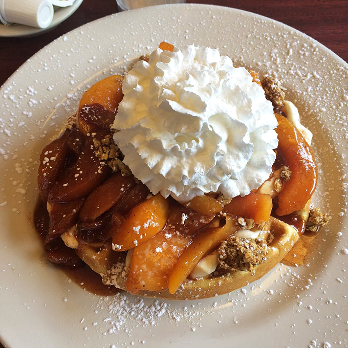 The peach waffle that launched a thousand cravings. Those caramelized peaches and cloud-like whipped cream could make morning people out of all of us.