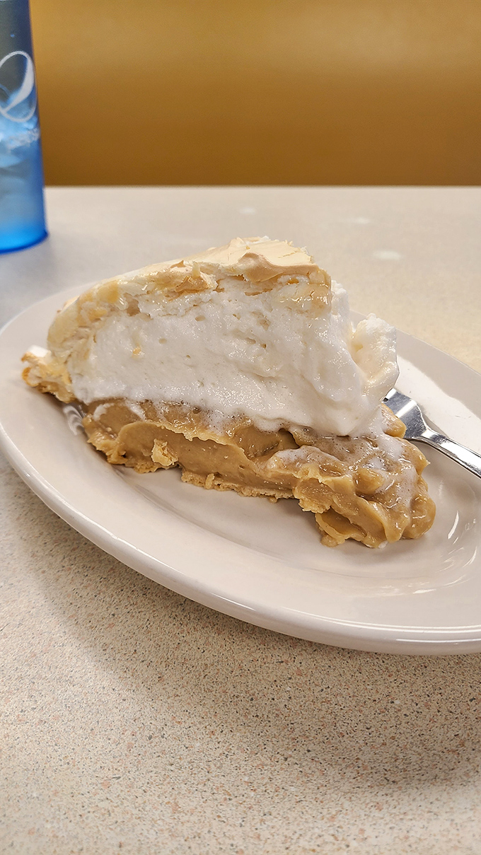 Peanut butter pie so silky it should require a license. One bite and you'll understand why it's worth every calorie.