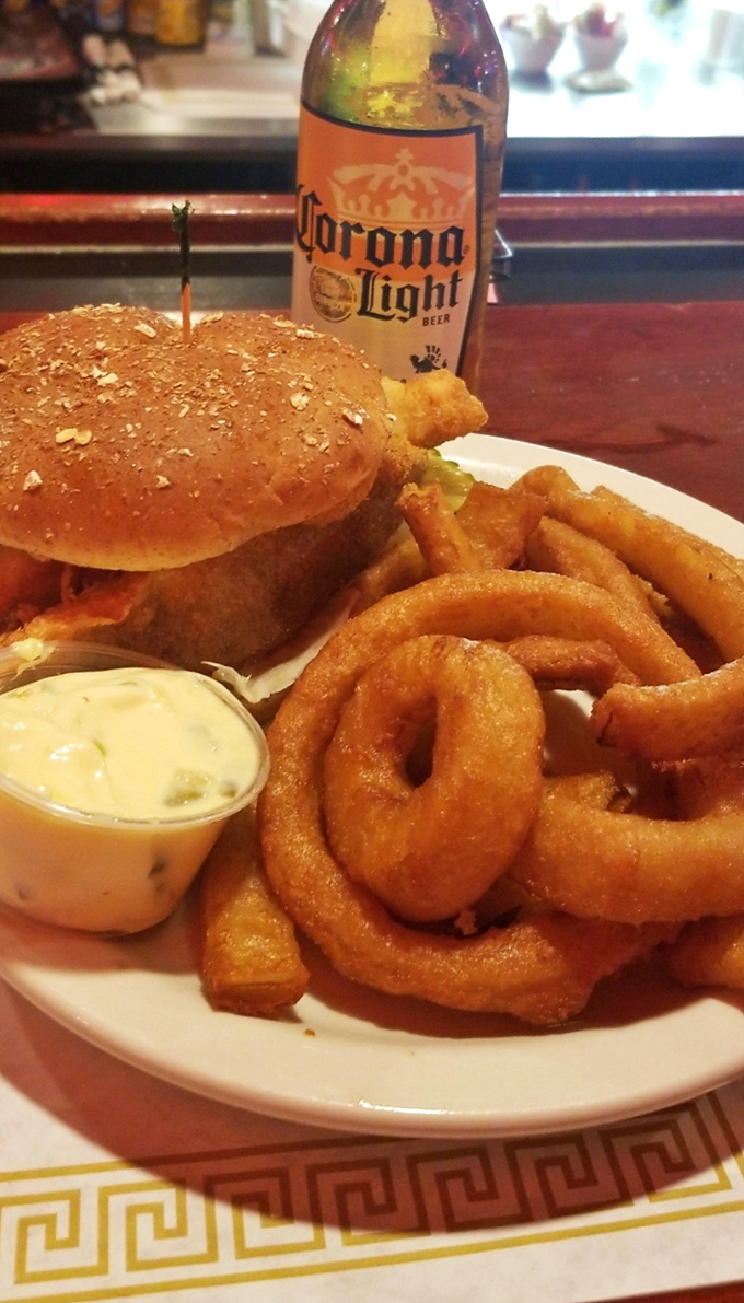 The perfect marriage of sandwich and sides&mdash;those onion rings aren't just garnish, they're golden halos of happiness waiting their turn.
