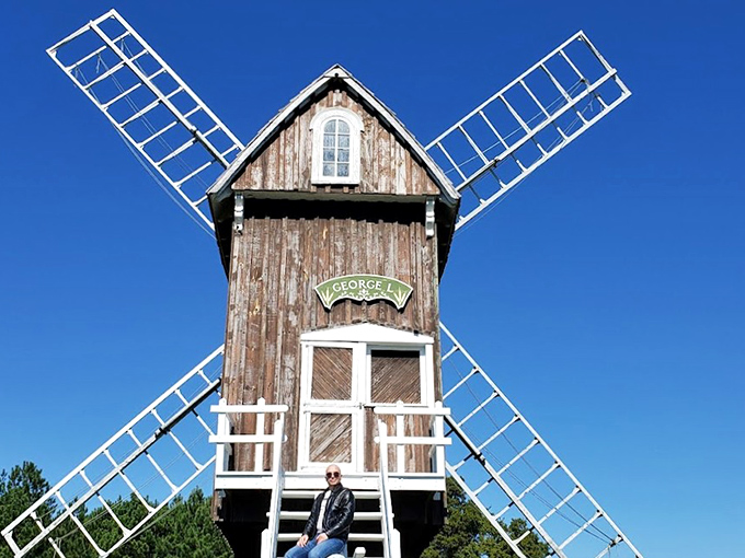 Taking a seat on history's doorstep, this visitor finds the perfect perch to contemplate simpler times and ingenious design. 