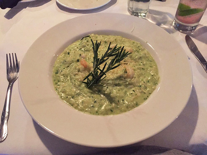 This pesto risotto isn't just green&mdash;it's money. The fresh rosemary sprig stands like a victory flag over creamy, herb-infused perfection.