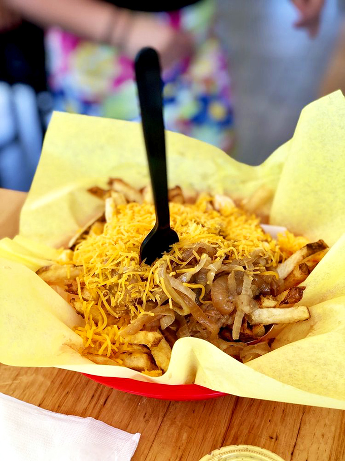 Piggy Fries: Where french fries go to fulfill their destiny, smothered in cheese, onions, and pure happiness.