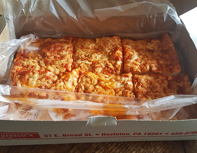 Pizza that doesn't need fancy toppings to impress. Carmen's red pizza proves that sometimes the simplest combinations create the most profound flavors.