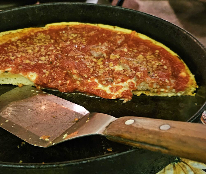 The star of the show&mdash;pan pizza with that perfect cornmeal-dusted crust and sauce that required generations to perfect. Worth every minute of the wait.