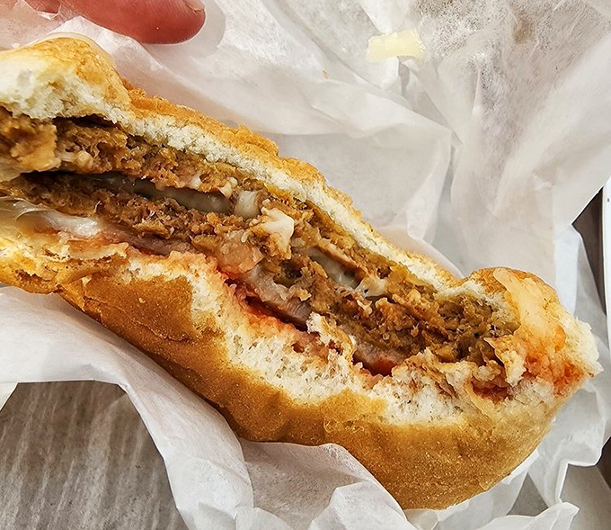 The coney dog in all its messy glory&mdash;where Cincinnati-style chili meets the perfect vessel. Napkins aren't optional; they're mandatory equipment.