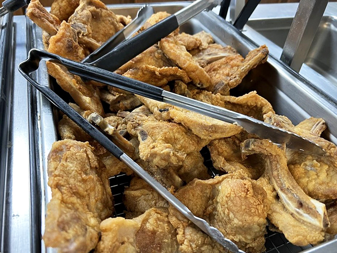 These golden-fried pork chops aren't just cooked—they're loved into existence. The kind of food that makes conversation stop and eyes close in appreciation.