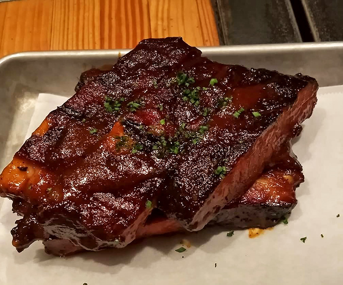 These ribs have that perfect lacquered glaze that makes you want to cancel your afternoon appointments. The meat doesn't fall off the bone&mdash;it respectfully parts ways when asked.