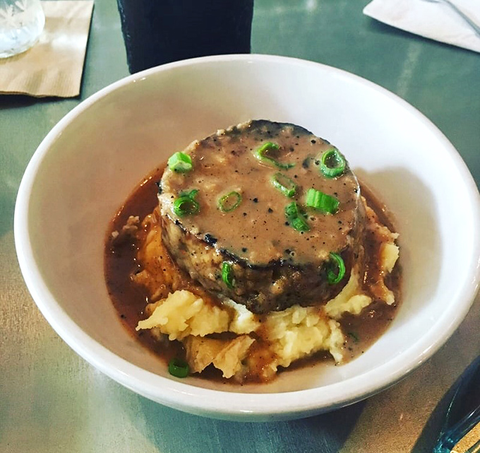 Who knew meatloaf could look this elegant? Pork shoulder takes center stage in gravy-covered glory.