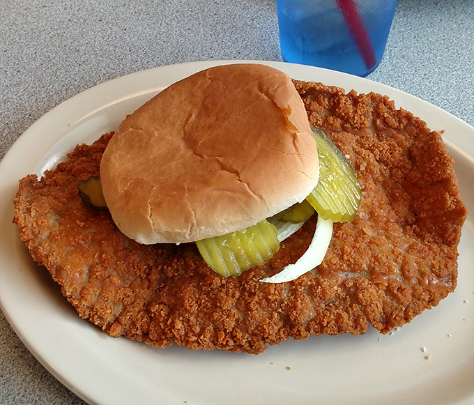 The pork tenderloin sandwich that's having an identity crisis&mdash;it thinks it's bigger than the plate. Crispy, golden perfection that makes Midwesterners proud.