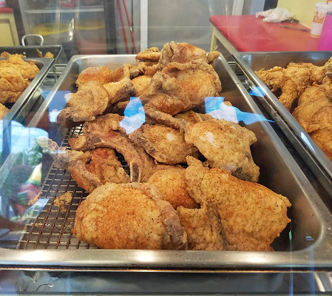 Saucy, crispy, and ready for their close-up—these fried morsels with that vibrant red sauce are what food dreams are made of.