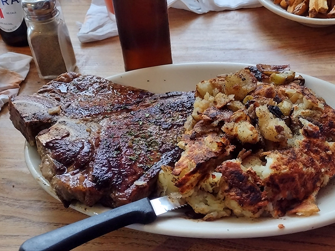 A porterhouse that would make Manhattan steakhouses nervous, served with home fries that somehow upstage even this magnificent cut.