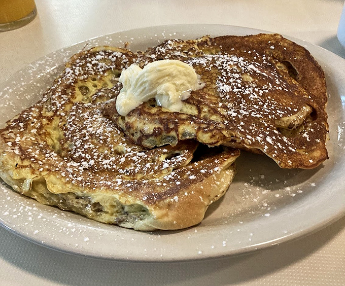 These potato pancakes deserve their own fan club. Dusted with powdered sugar and topped with a dollop of butter&mdash;carb heaven has never looked so good.