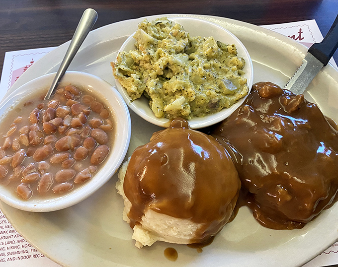 When gravy pools around perfectly seasoned potatoes and homemade sides, you know you've found a place that understands the architecture of comfort food.