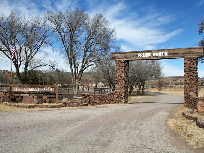 Gateway to adventure! Prude Ranch's stone entrance promises authentic Texas hospitality with a side of mountain magic.